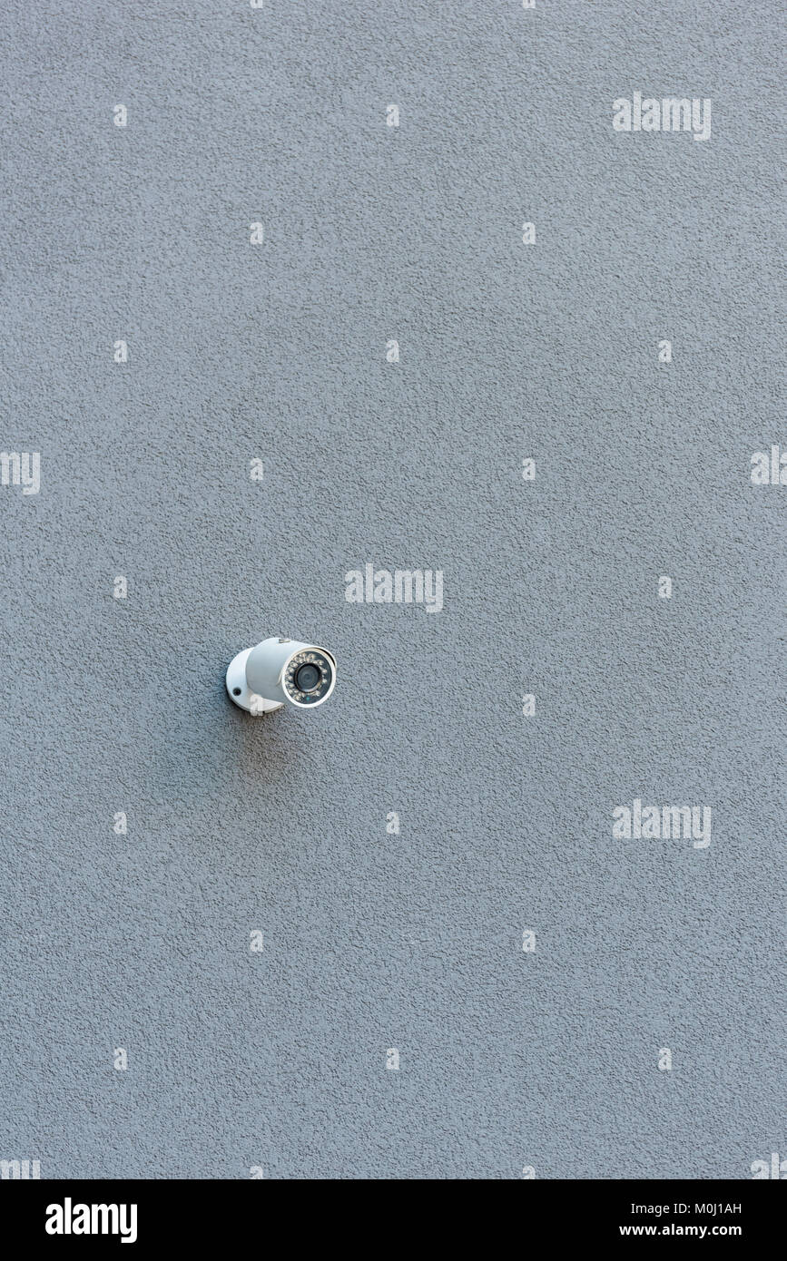 one security camera on grey brick wall, security system concept Stock ...