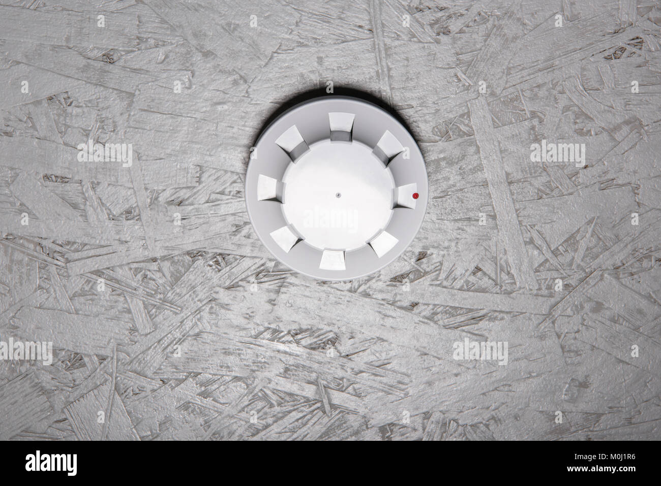 smoke detector of fire alarm on white ceiling at home Stock Photo - Alamy