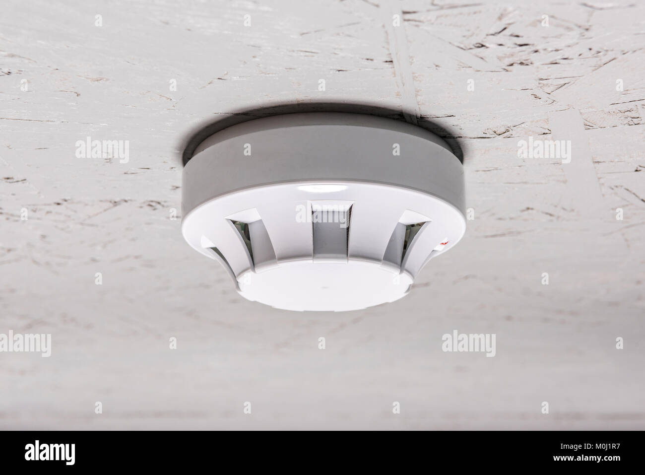 smoke detector of fire alarm on white ceiling at home Stock Photo - Alamy