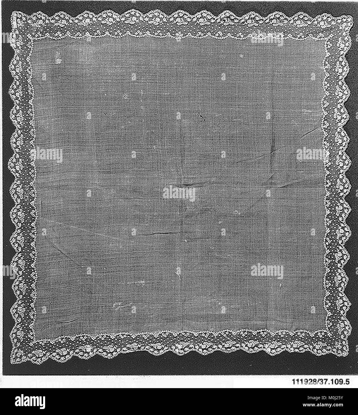 A decorative kerchief (pañuelo) featuring intricate embroidery ...