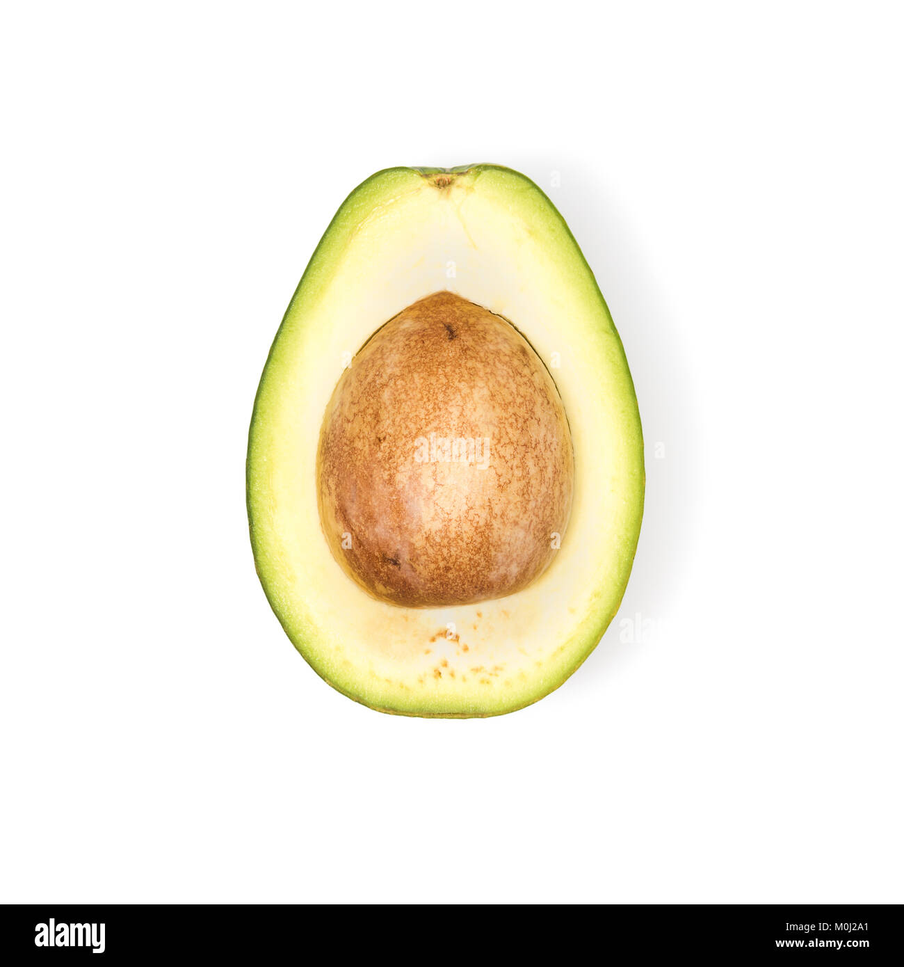 half of fresh avocado with seed Stock Photo - Alamy