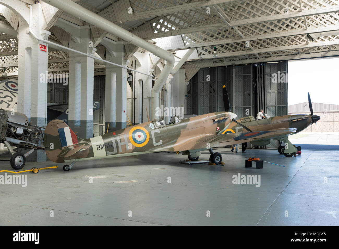 Supermarine Spitfire, with a Hawker Hurricane behind, in an aircraft ...