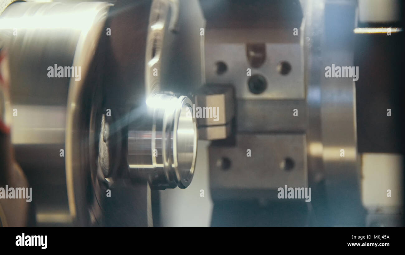 Manufacture of metal parts on the machine at the factory Stock Photo ...