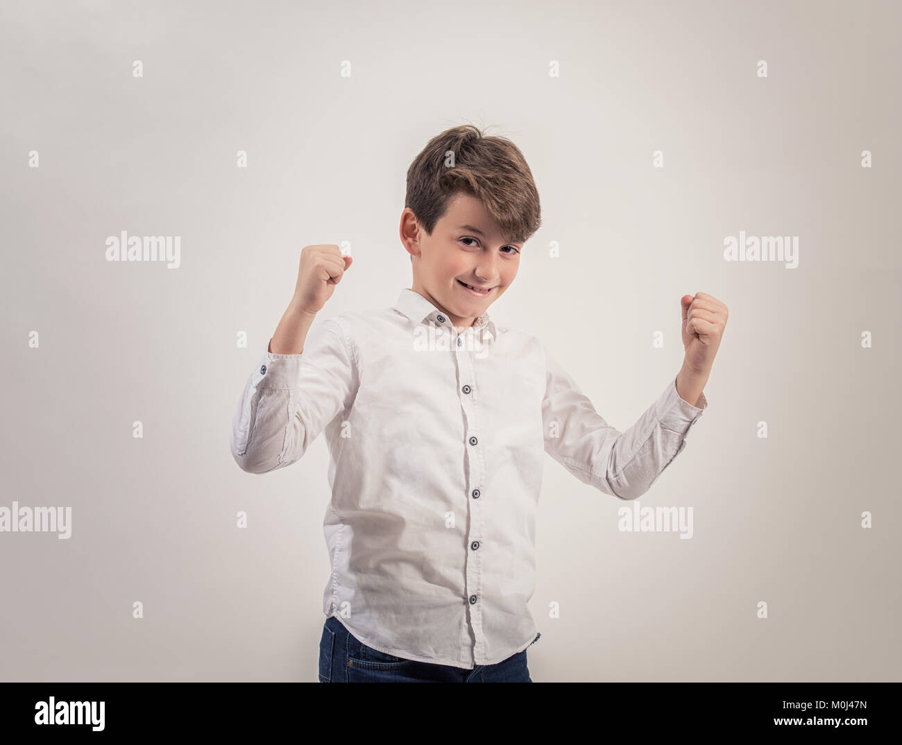 Portrait caucasian boy on grey background,Strong and Proud Stock Photo ...