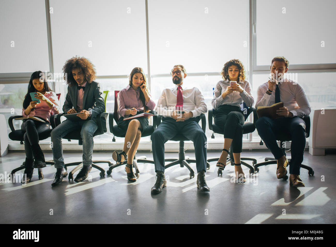 Busy office environment Stock Photo - Alamy