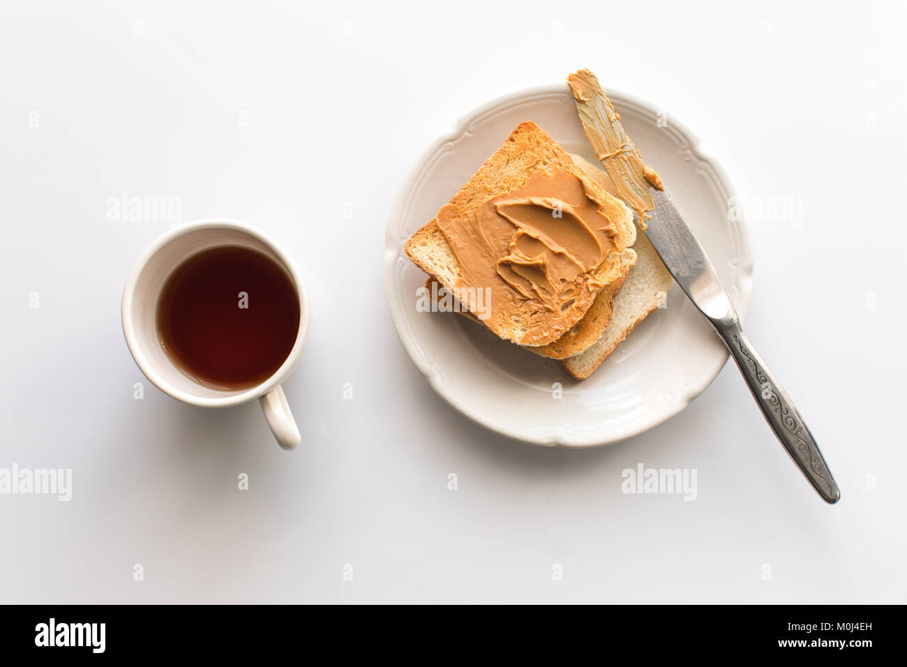 toasts with peanut butter and tea Stock Photo - Alamy