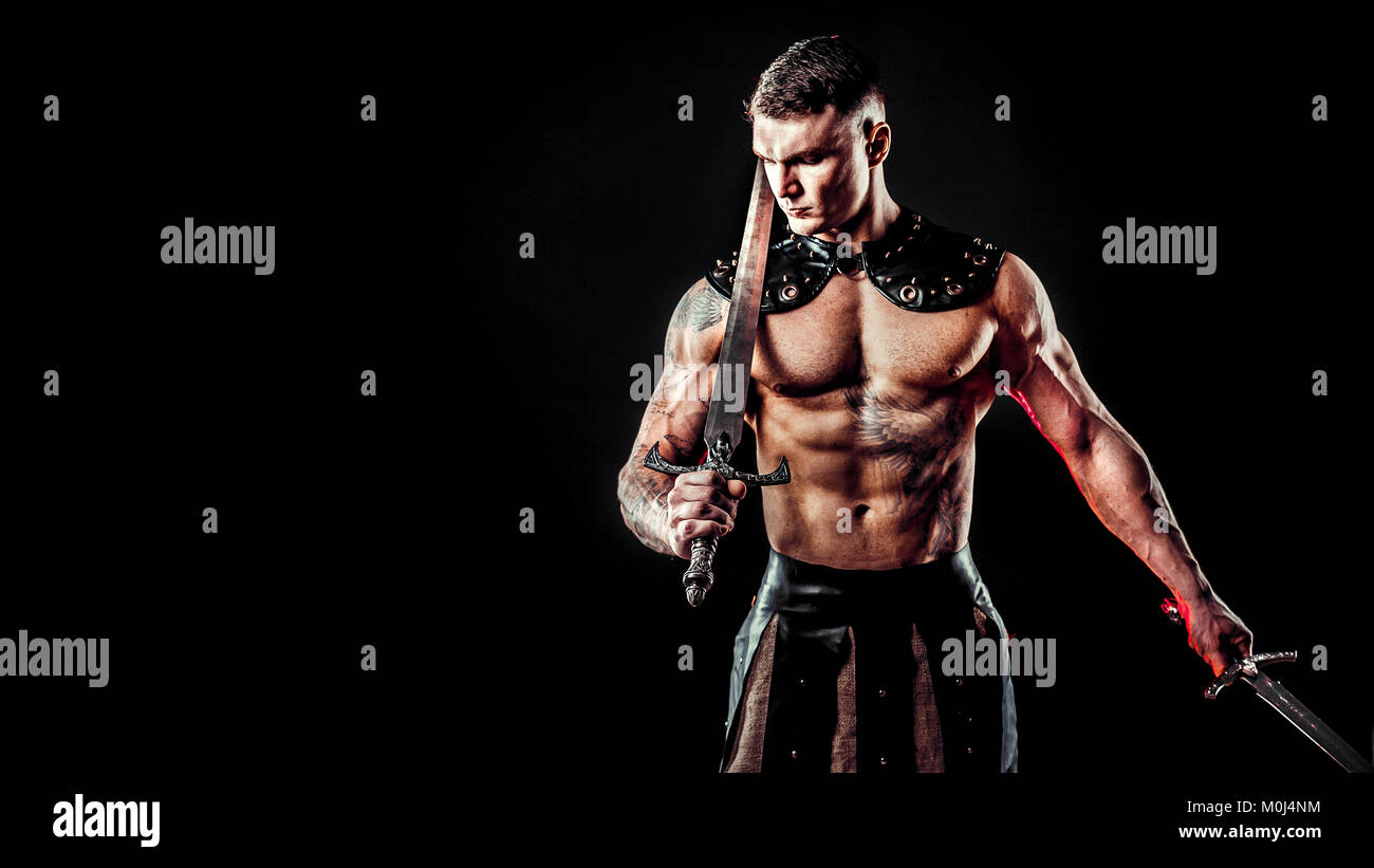 Portrait handsome muscular gladiator sword hi-res stock photography and ...
