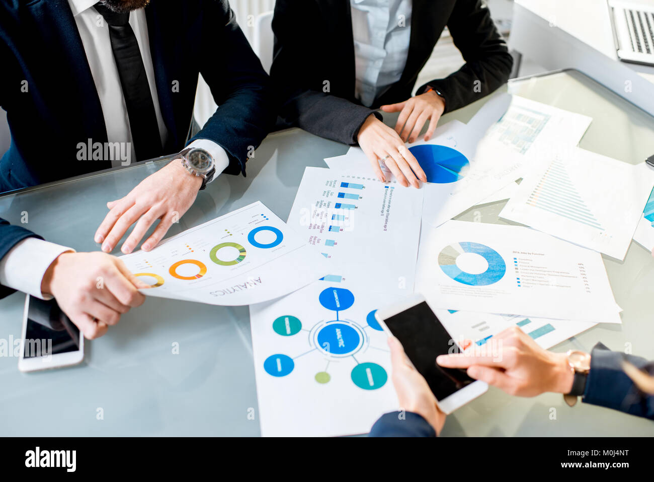 People working on business charts Stock Photo - Alamy