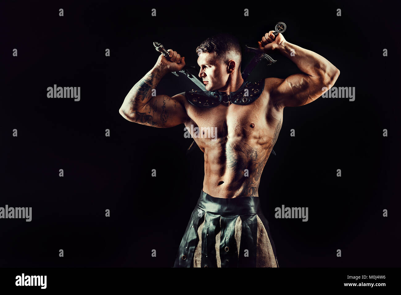 Portrait handsome muscular gladiator sword hi-res stock photography and ...