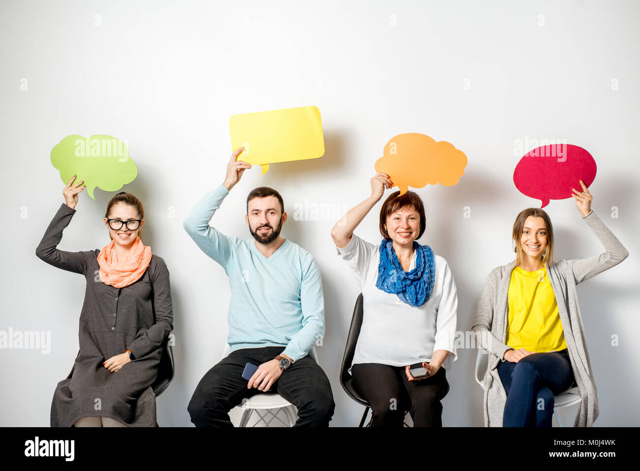People holding colorful bubbles Stock Photo - Alamy