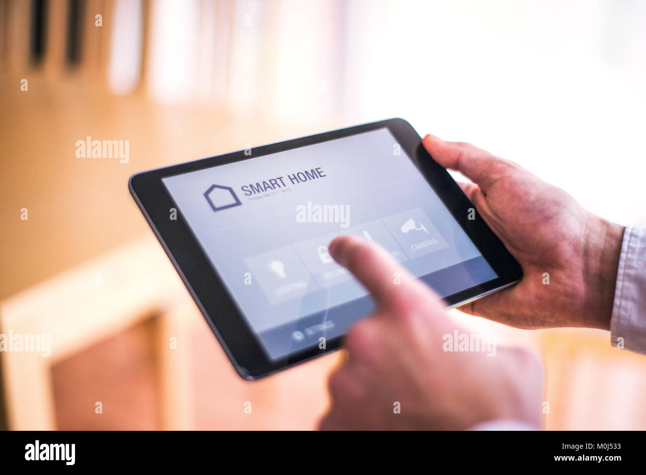 A tablet with smart home screen Stock Photo - Alamy