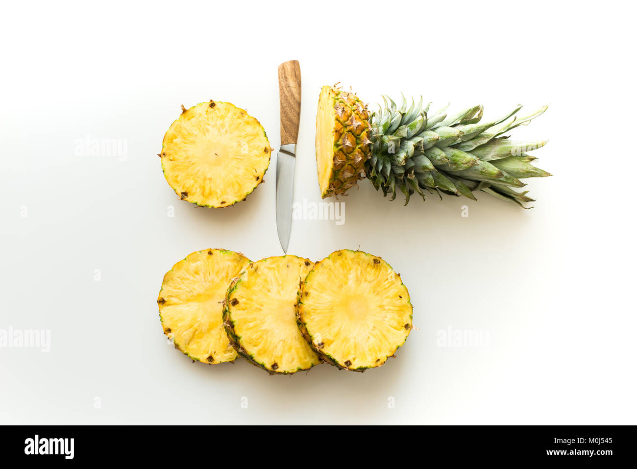 Pineapple slices cut knife hi-res stock photography and images - Alamy