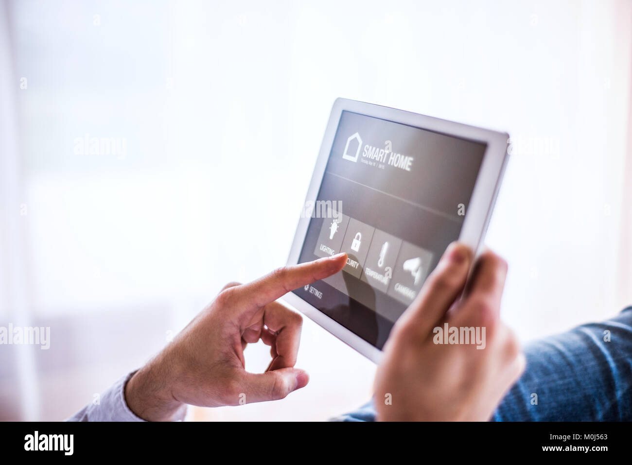 A tablet with smart home screen Stock Photo - Alamy