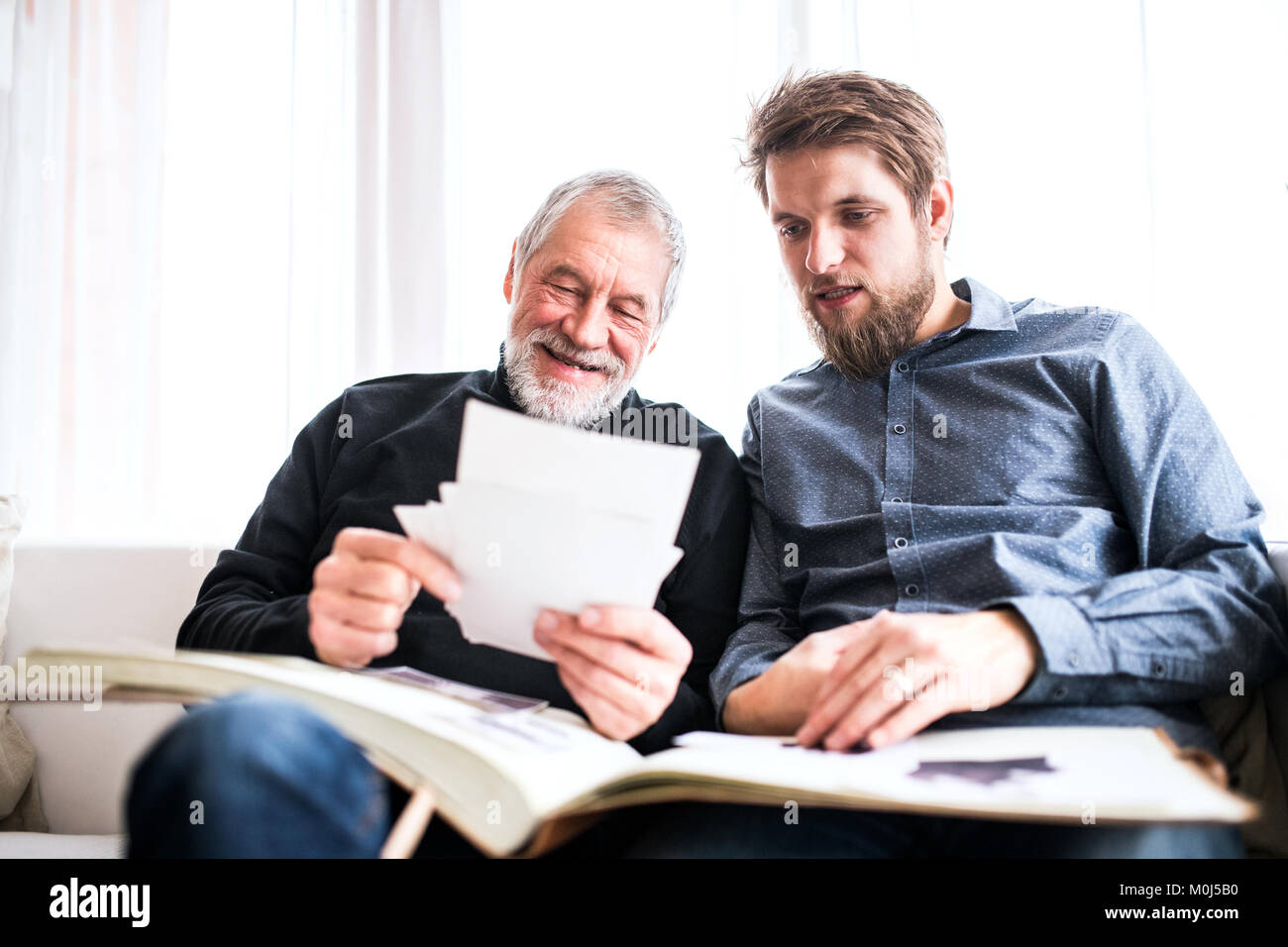 Hipster son and his senior father at home Stock Photo - Alamy