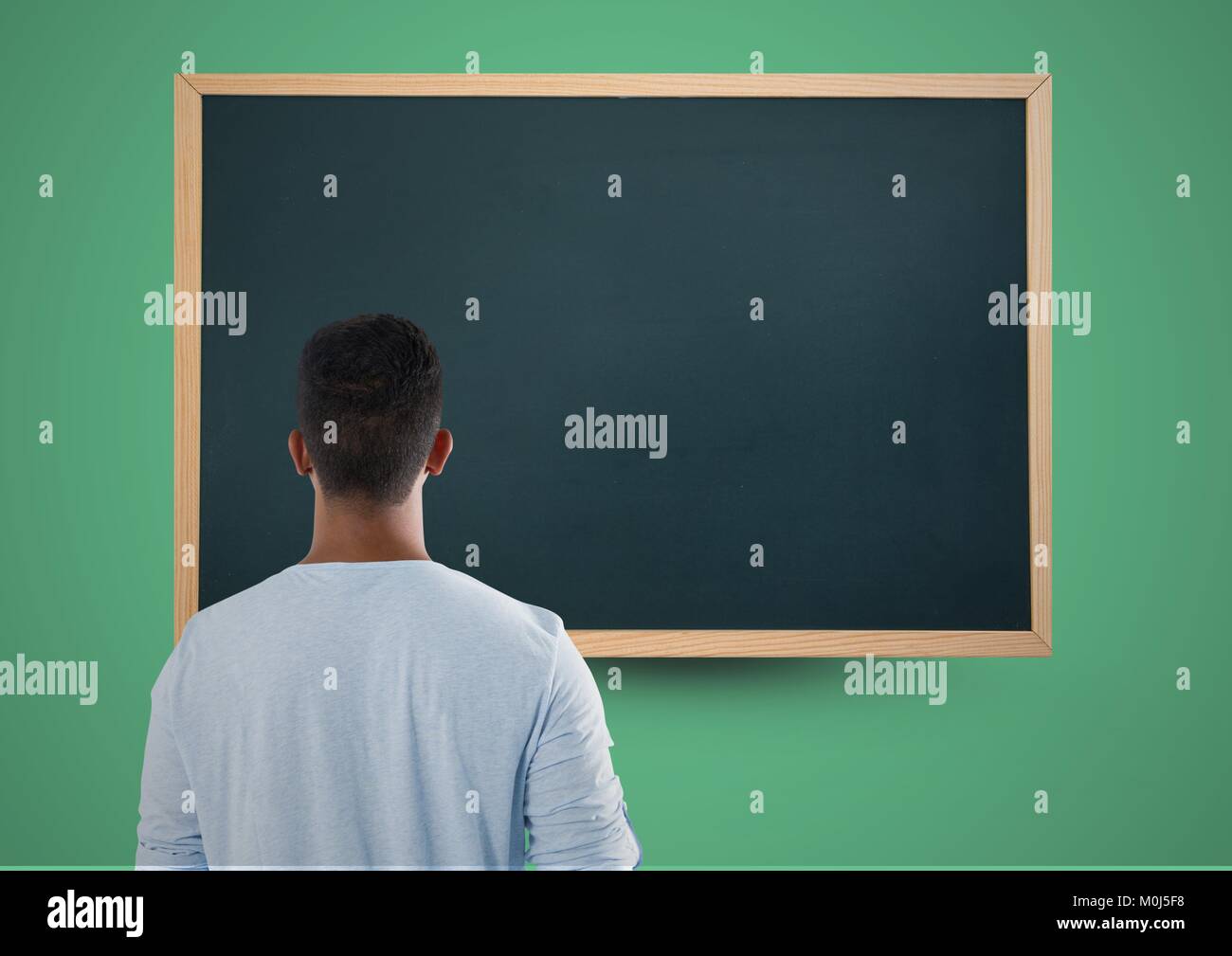 Teenager looking at blank background Stock Photo - Alamy