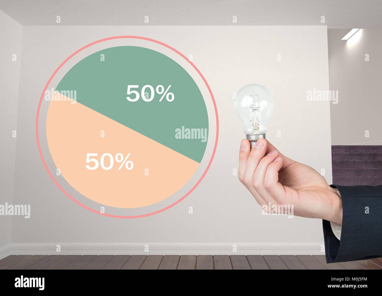 Hand holding light bulb with colorful chart statistics Stock Photo - Alamy