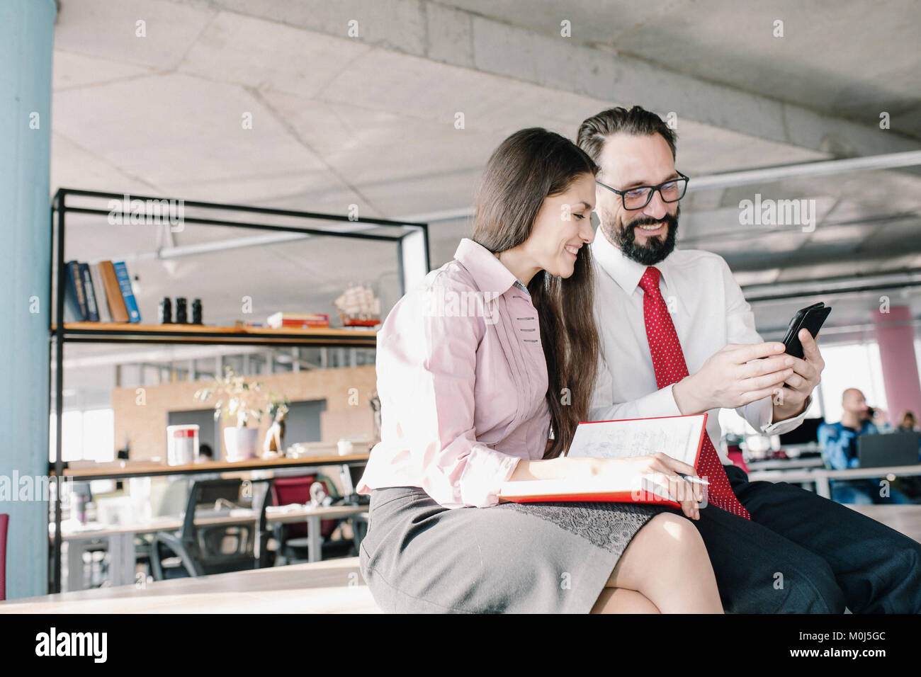 Young team of coworkers making great meeting discussion Stock Photo - Alamy