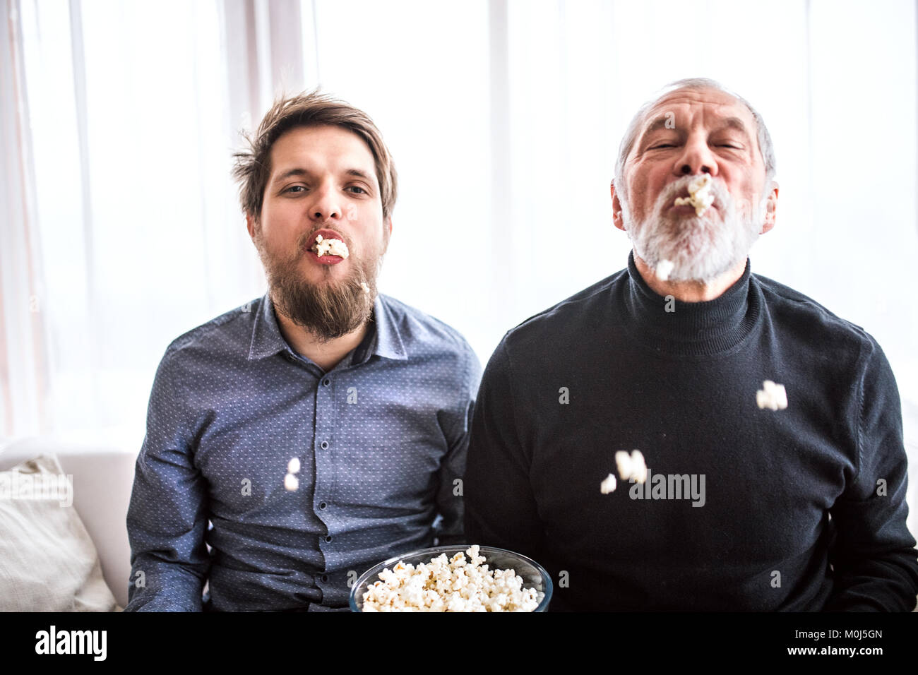 Hipster son and his senior father at home Stock Photo - Alamy