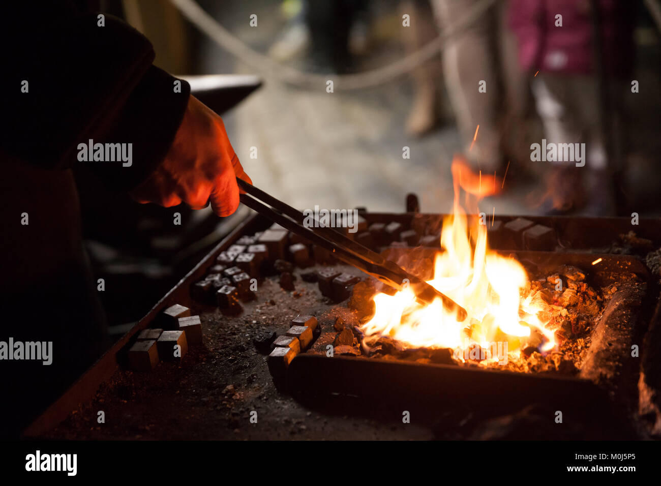 Blacksmith doing his job with his basic tools Stock Photo - Alamy
