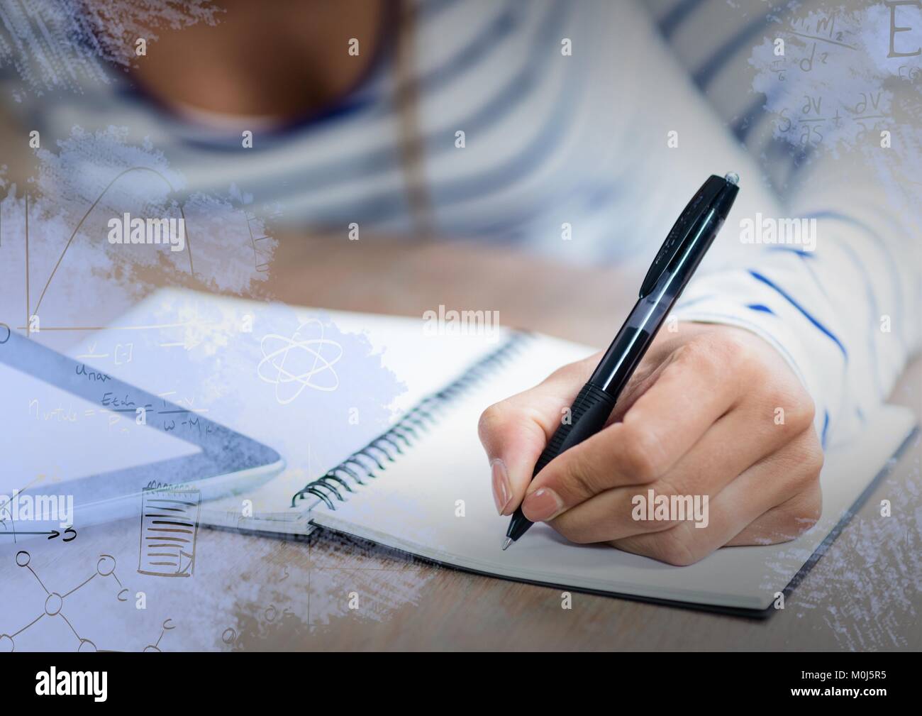 Hand writing with graph overlays Stock Photo - Alamy