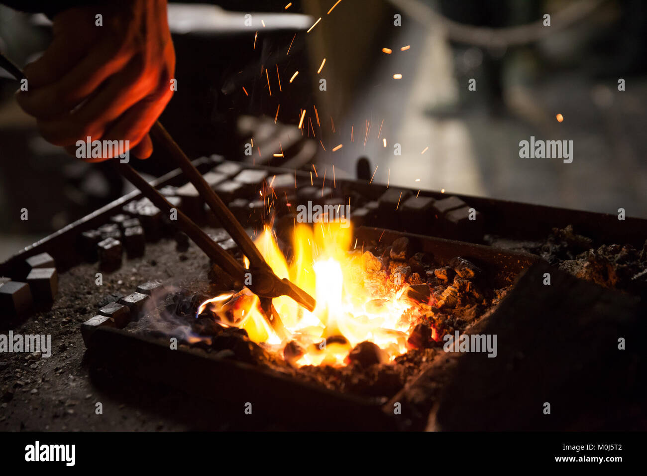 Blacksmith doing his job with his basic tools Stock Photo - Alamy