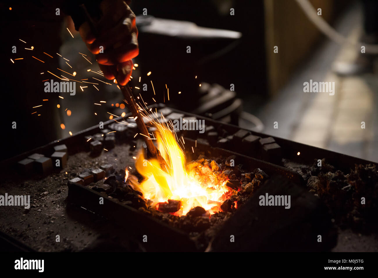 Blacksmith doing his job with his basic tools Stock Photo - Alamy