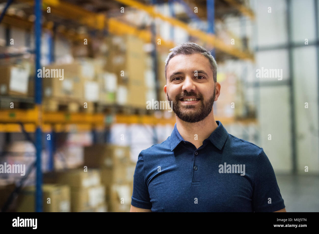 Portrait of a male warehouse worker Stock Photo - Alamy