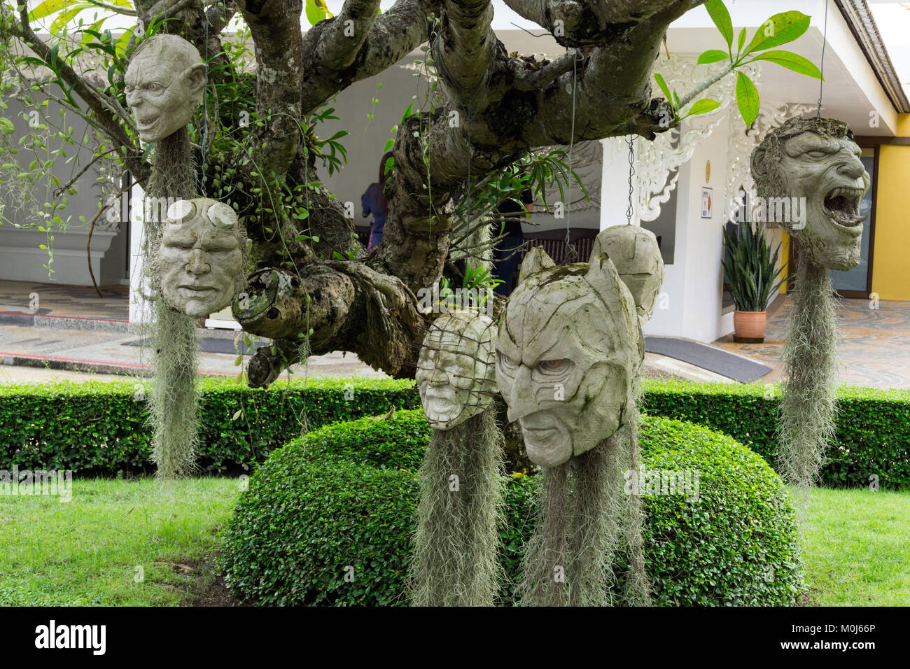 Heads of fantasy characters hanging on a tree hi-res stock photography ...