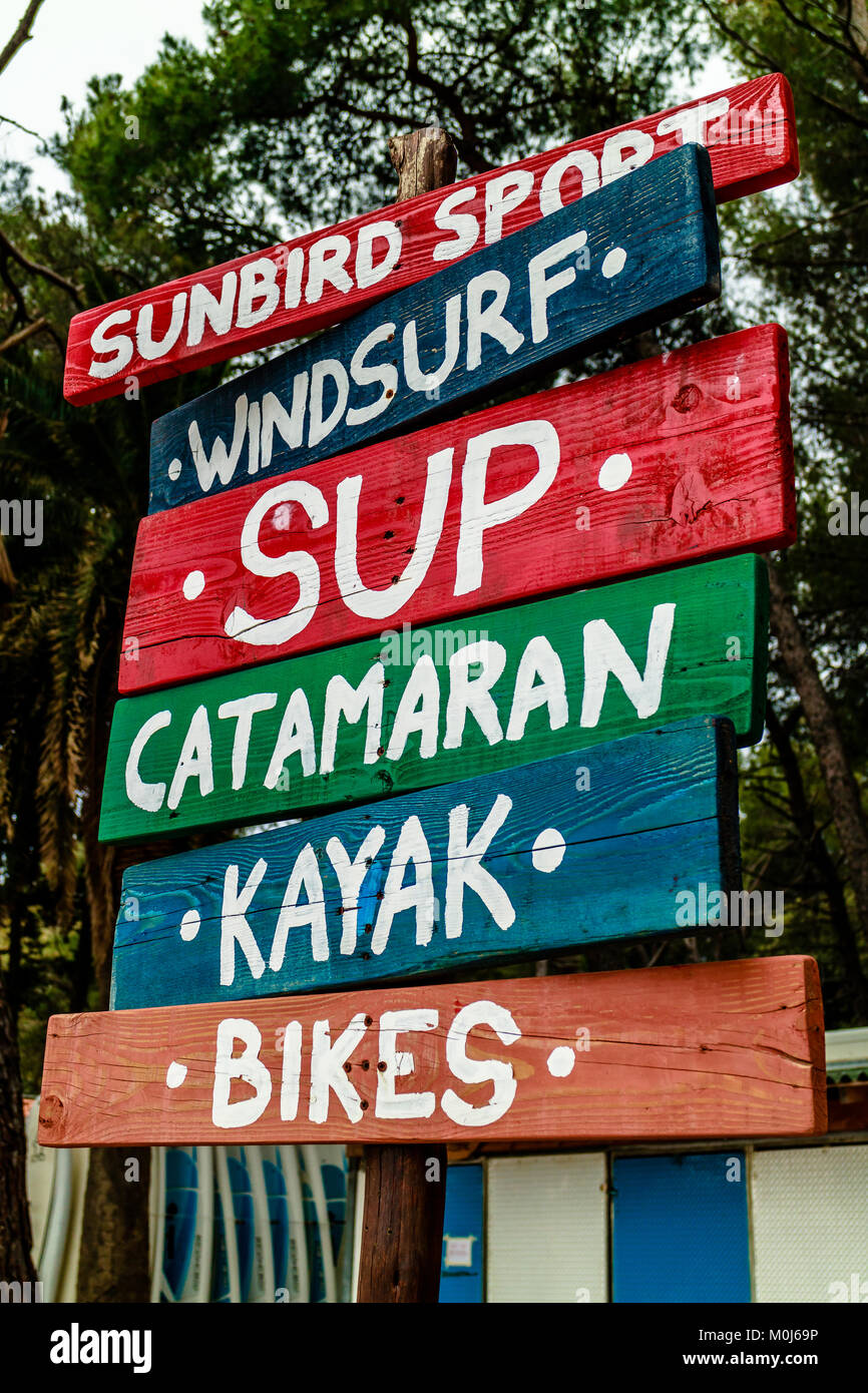 Colourful wooden sign advertising watersports and activities and ...
