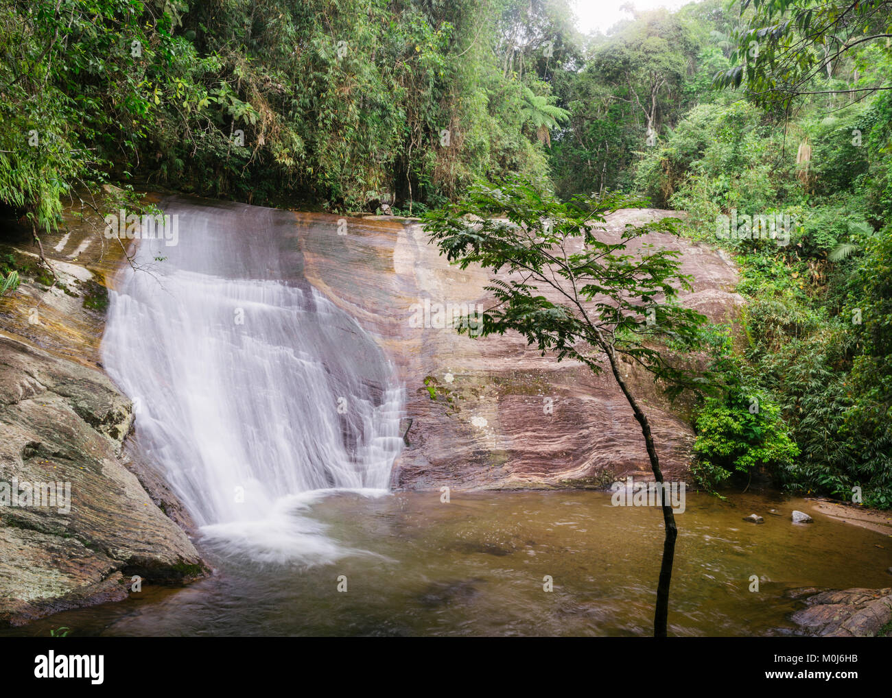 Waterfall in tropical rainforest, Penedo, Rio de Janeiro, Brazil Stock ...