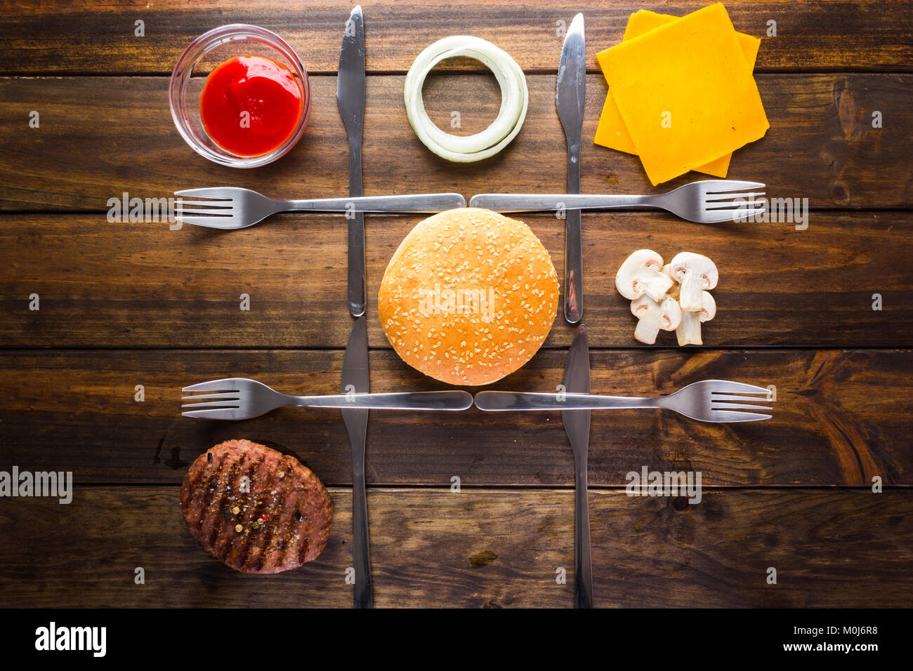 tic tac toe burger on wood background Stock Photo - Alamy