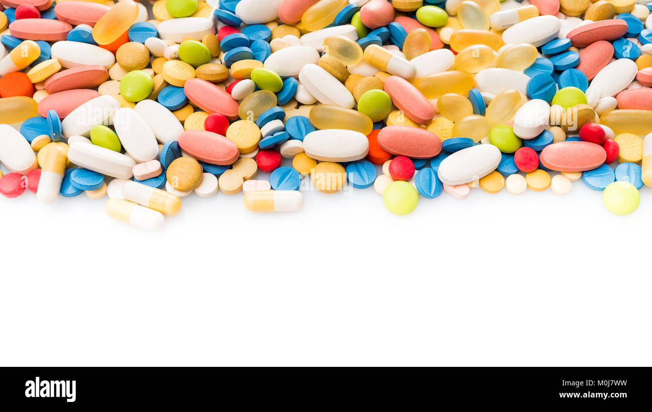 pills border over white. colorful pills isolated on white Stock Photo ...