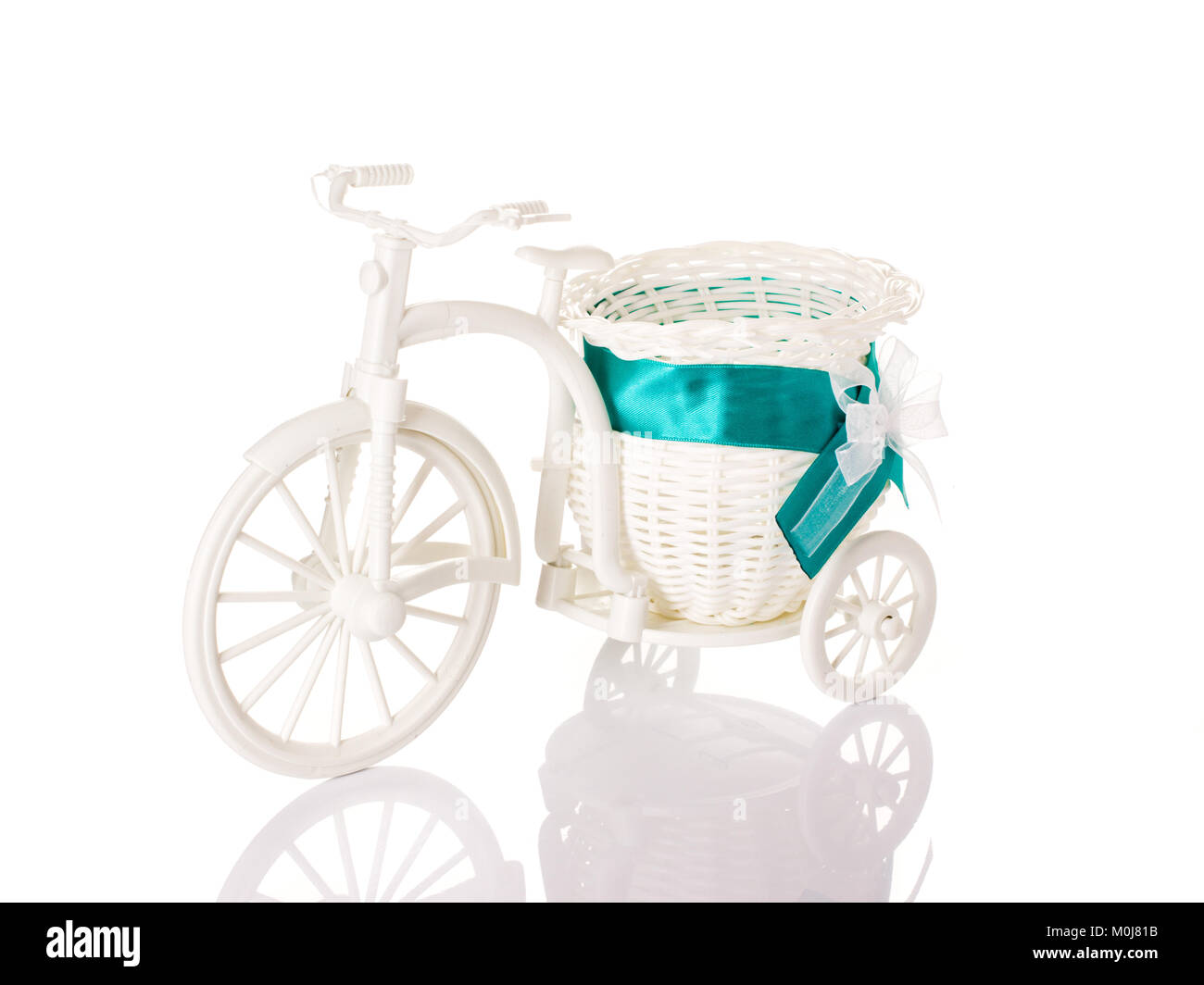 toy bicycle with basket on white background Stock Photo - Alamy