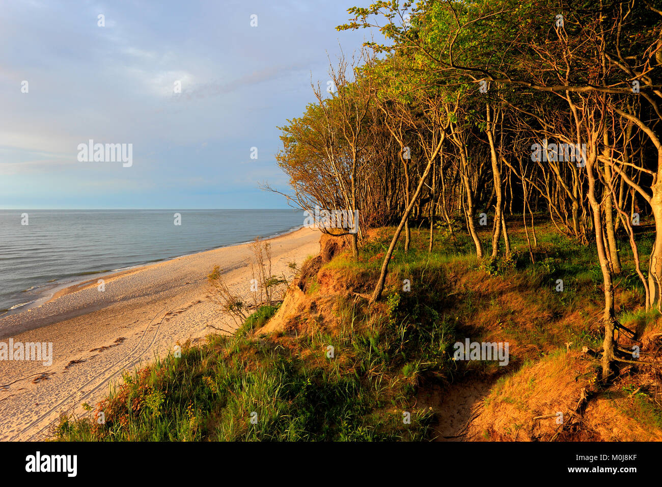 Baltic Sea shore and beach during colorful sunset in Rowy, Pomerania ...