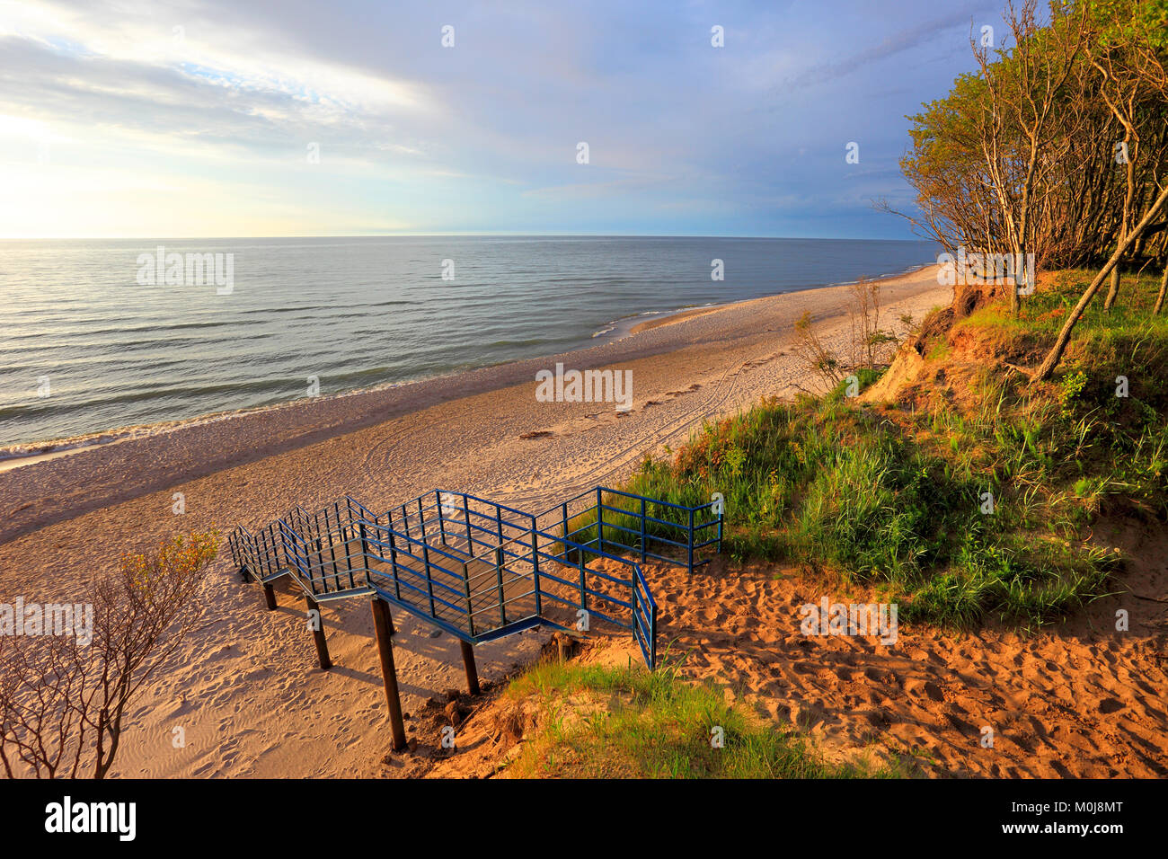 Baltic Sea shore and beach during colorful sunset in Rowy, Pomerania ...