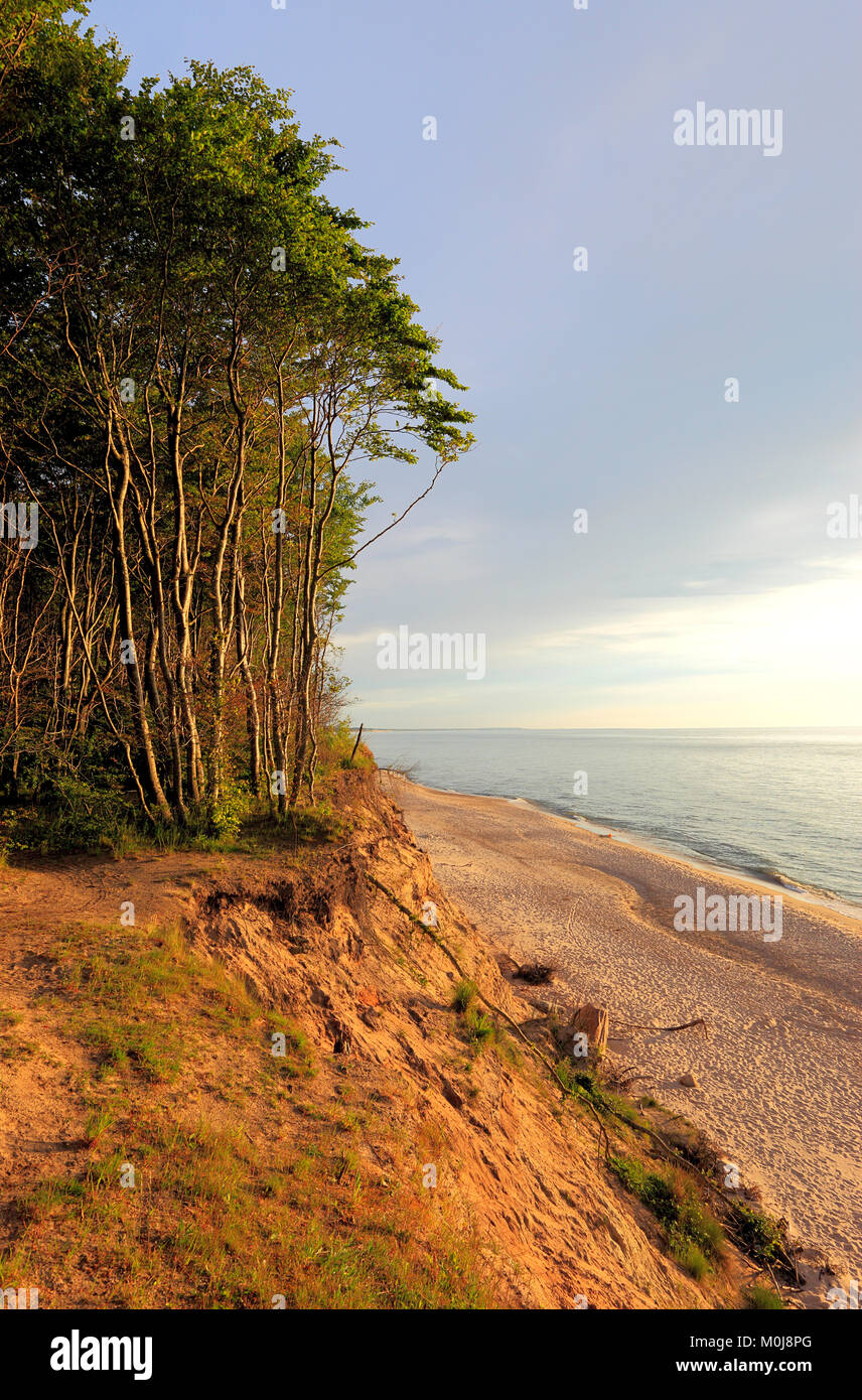 Baltic Sea shore and beach during colorful sunset in Rowy, Pomerania ...