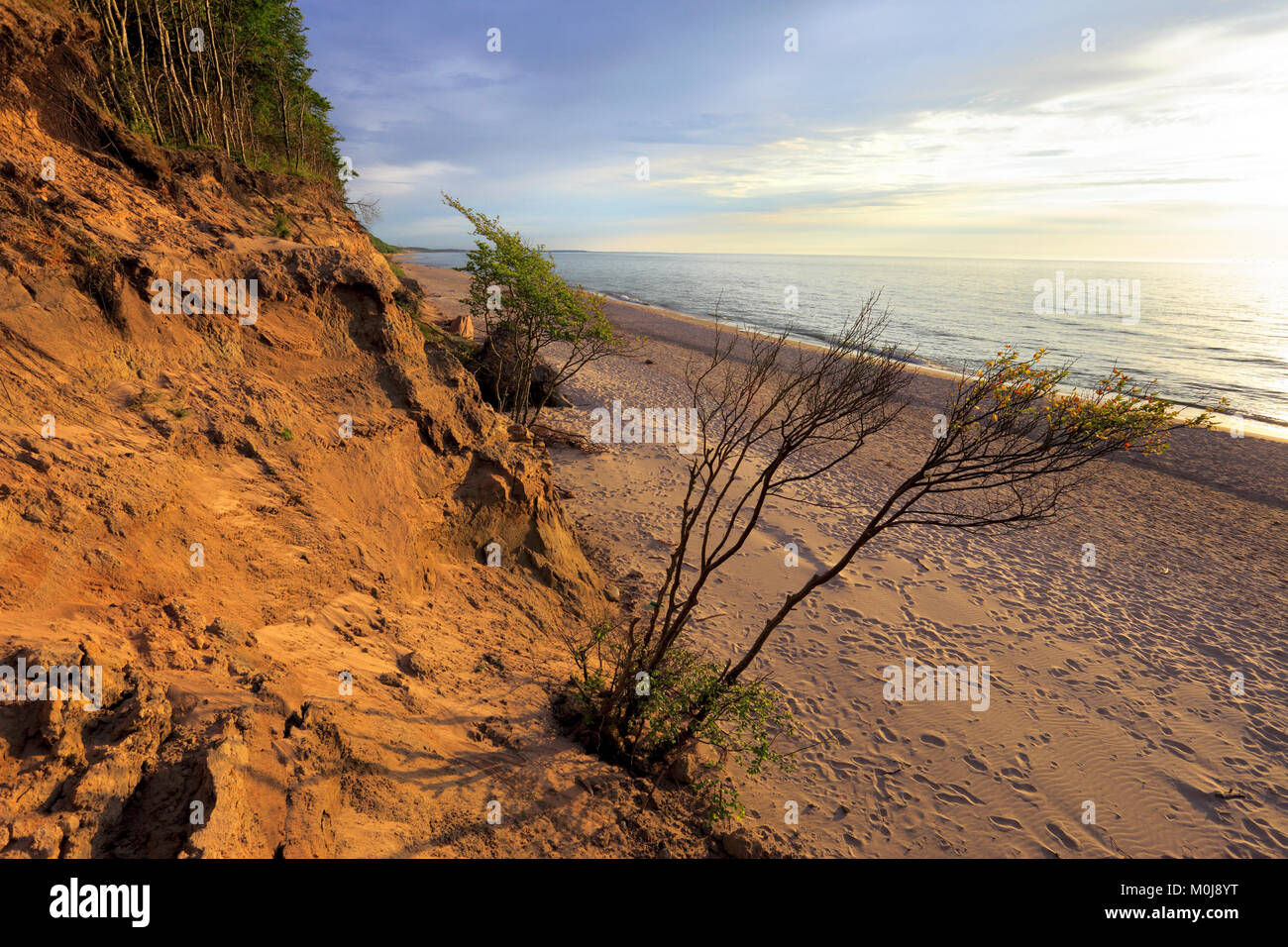 Baltic Sea shore and beach during colorful sunset in Rowy, Pomerania ...
