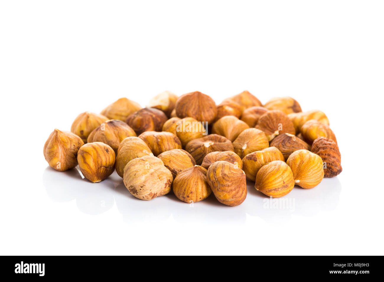 Group of peeled hazelnuts isolated on a white background Stock Photo ...