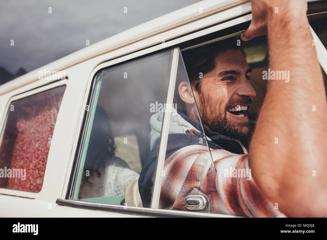 Mature man driving van and enjoying on his road trip. Caucasian man ...