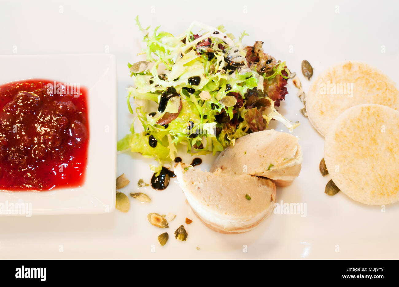 Home made rabbit pate with crispy toast and cranberry sauce Stock Photo ...