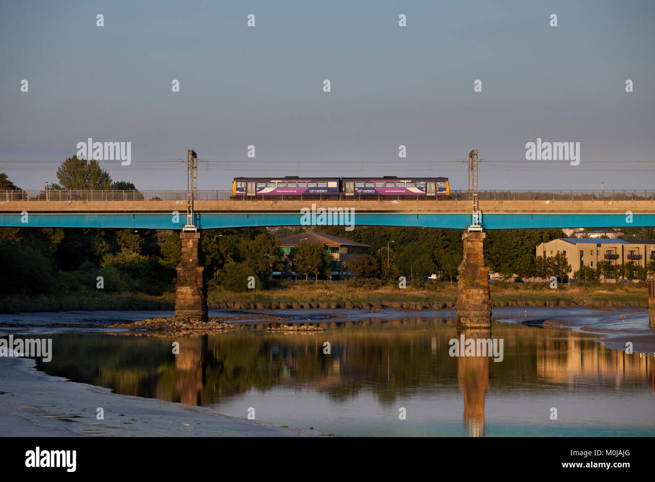 A Northern rail class 142 pacer train crosses Carlisle bridge ...