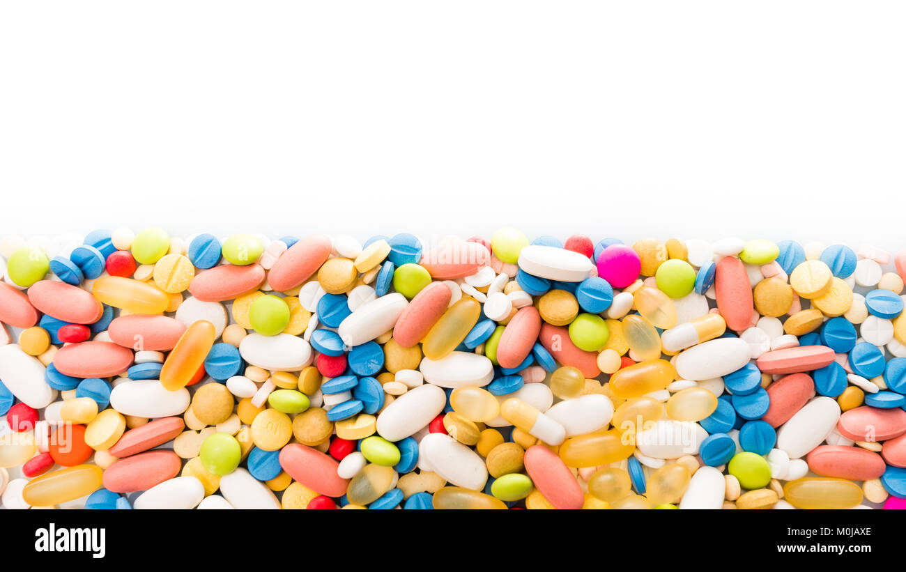 pills border over white. colorful pills isolated on white Stock Photo ...