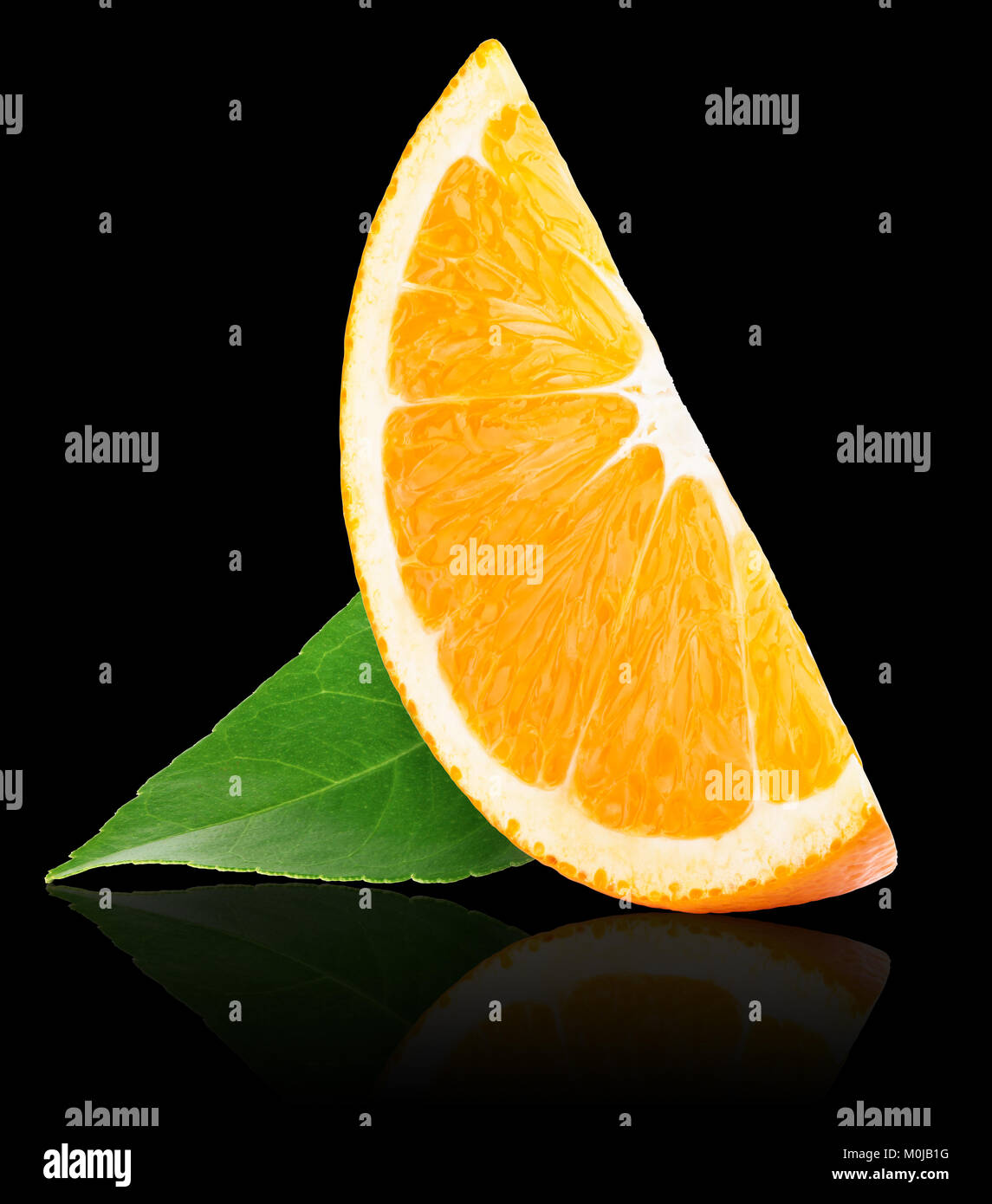 Orange slice with leaf isolated on the black background with clipping ...