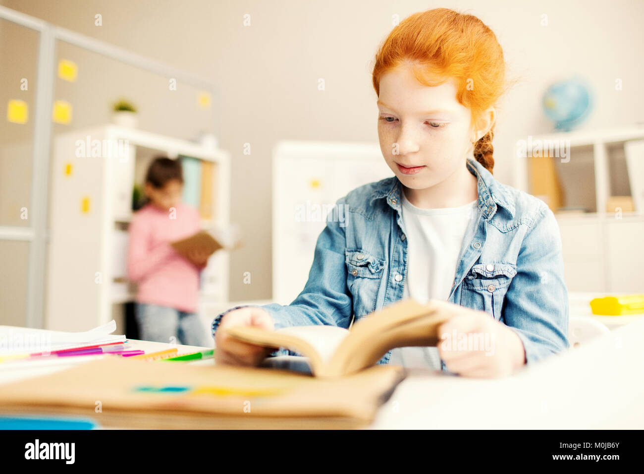 Looking through book pages Stock Photo - Alamy