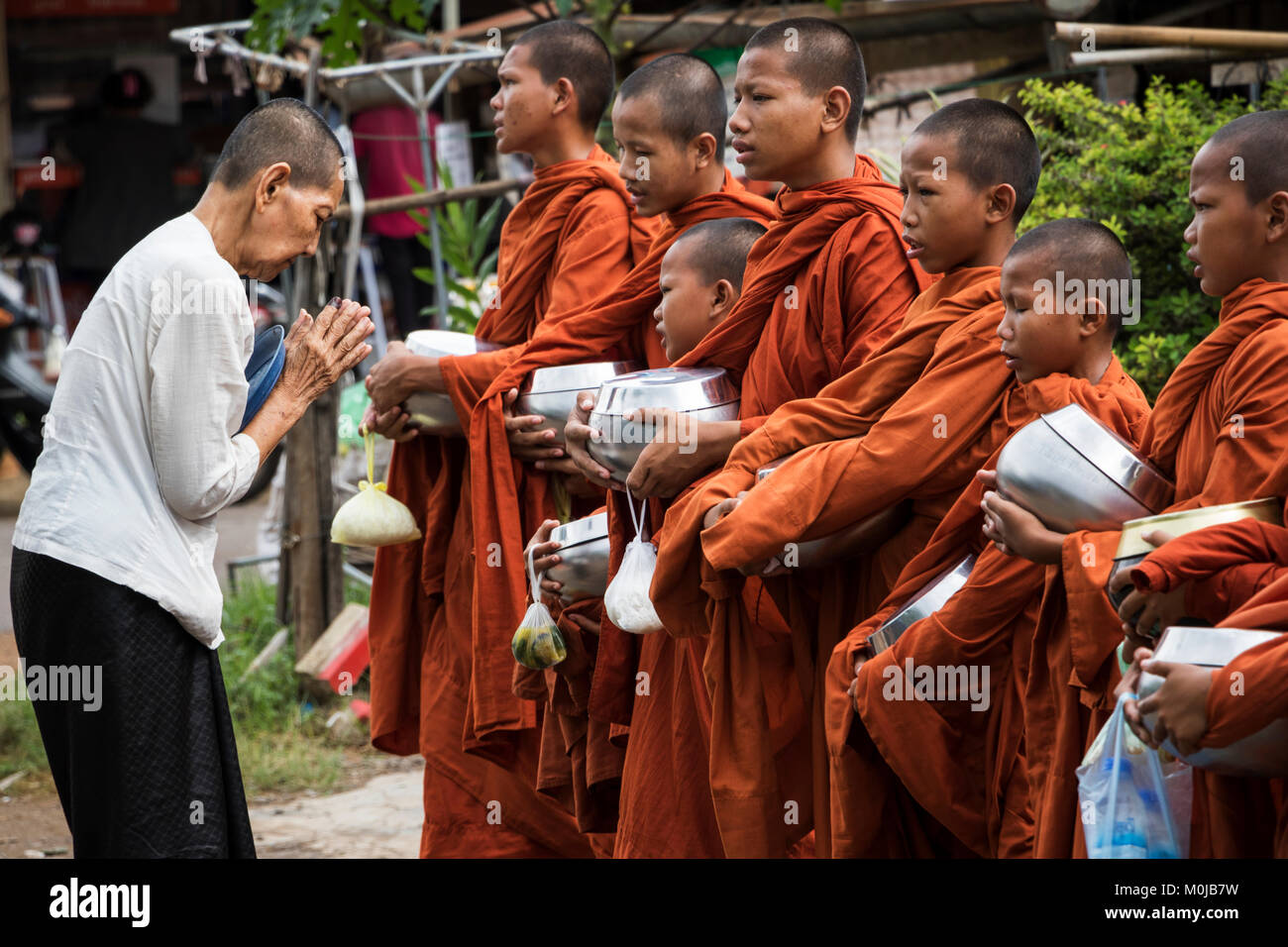 Receiving alms hi-res stock photography and images - Alamy