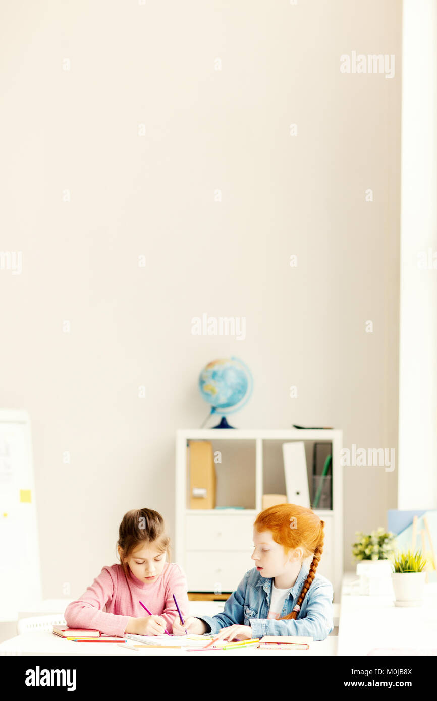 Teamwork at lesson Stock Photo - Alamy