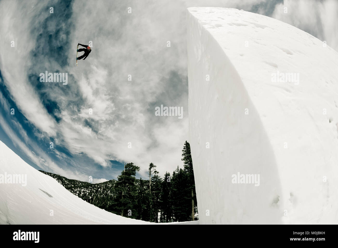 A professional snowboarder flipping mid-air at Heavenly Resort; South ...