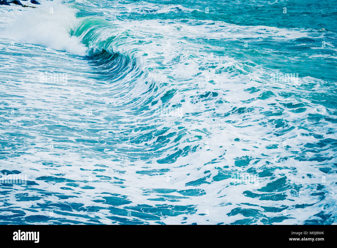 ocean waves breaking natural background Stock Photo - Alamy