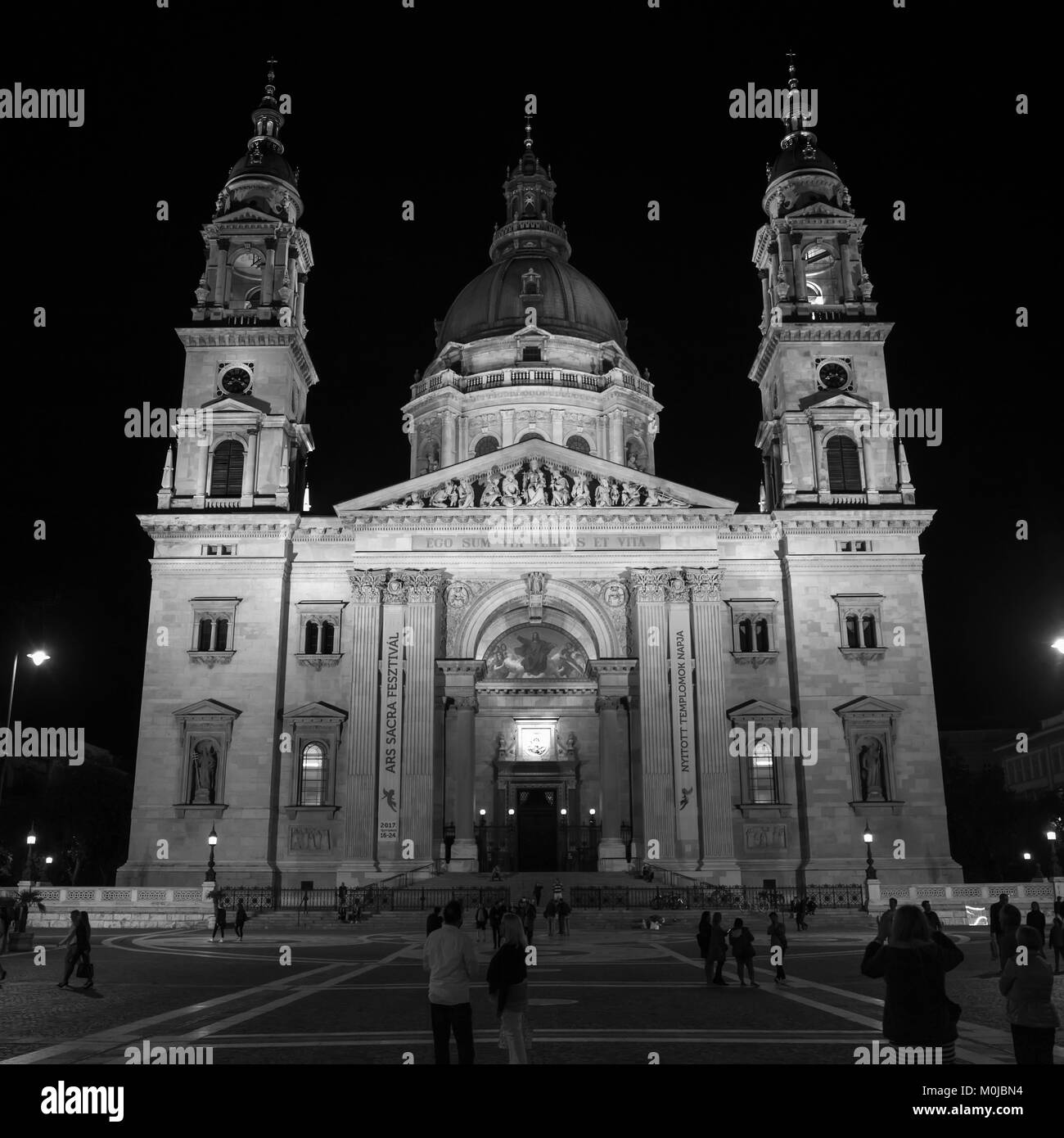 St. Stephen's Basilica at nighttime with tourists on the street ...