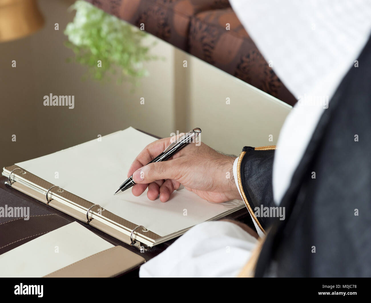 Saudi Arabian Man Hand Writing on A Notebook in a Luxury Home ...
